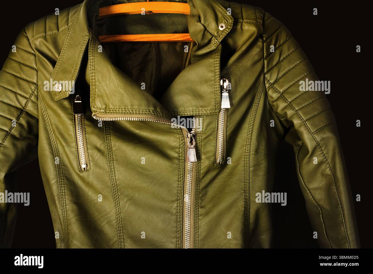 Photo of green colored motorcycle leather biker jacket on black ...