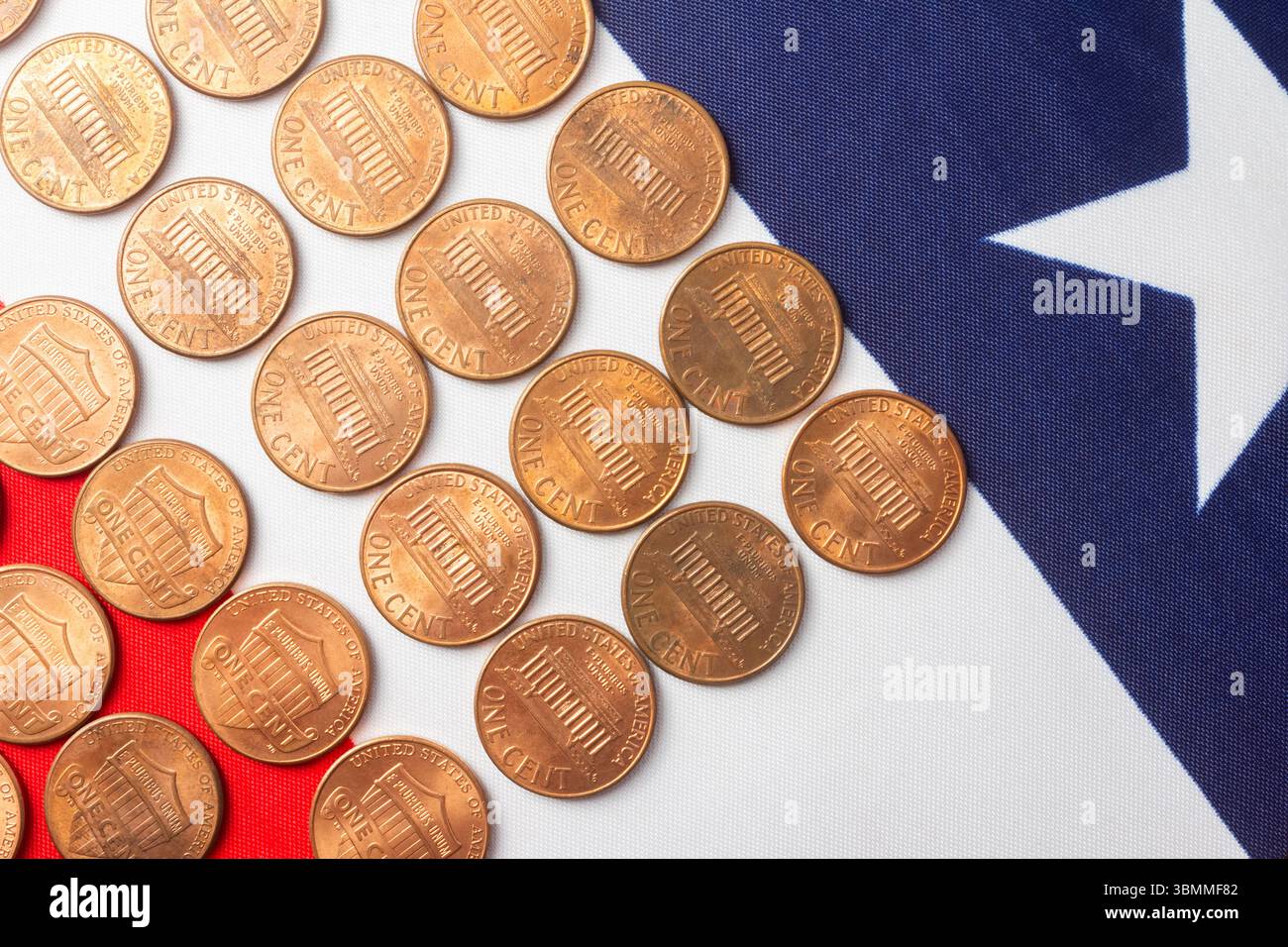 Photo of USA one cent or penny coin collection laying on american flag ...