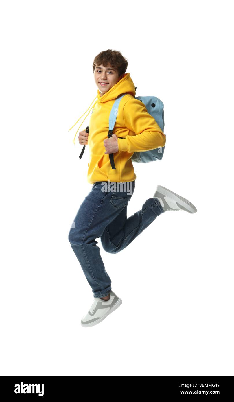 Happy teenage boy jumping on white background Stock Photo - Alamy