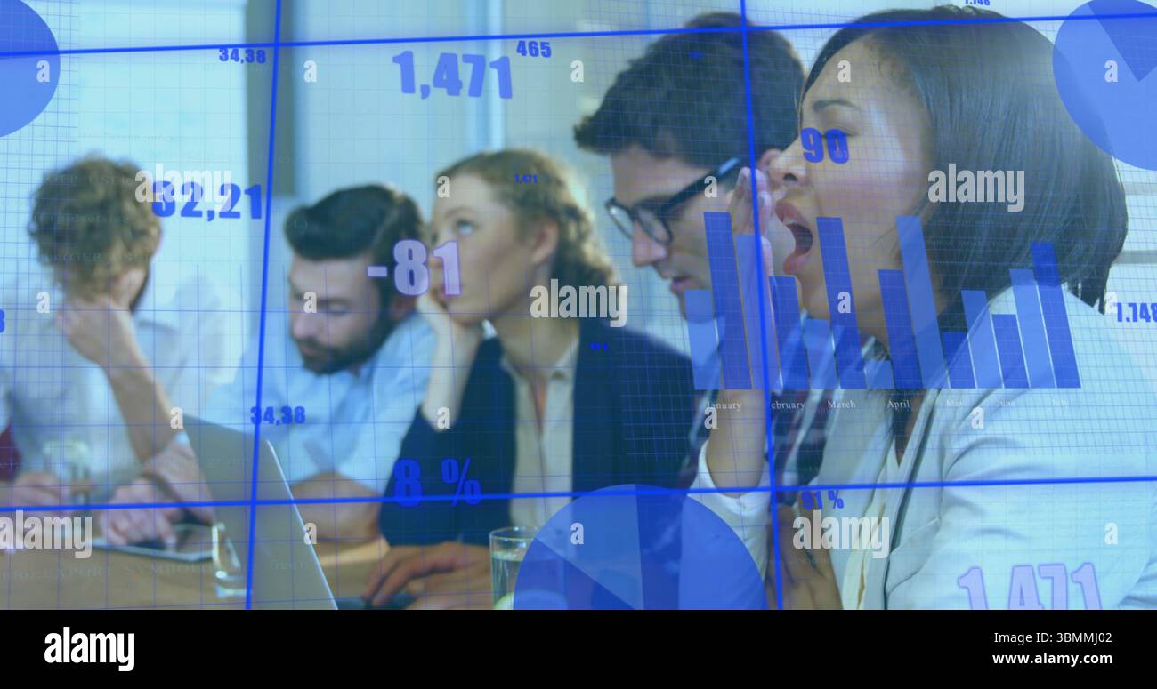 Yawning female colleague wearing light blazer at conference table, with ...