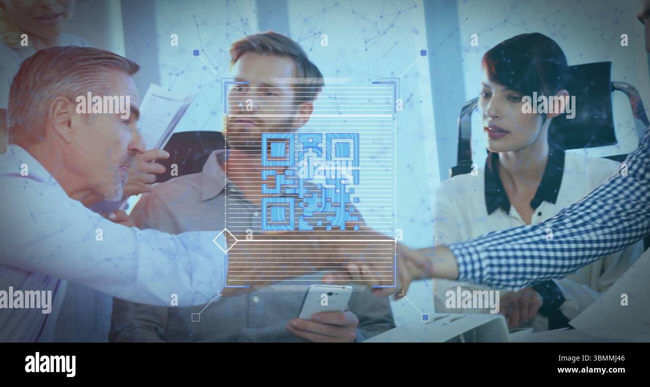 Leaning group reviewing smartphone in modern conference room, with ...