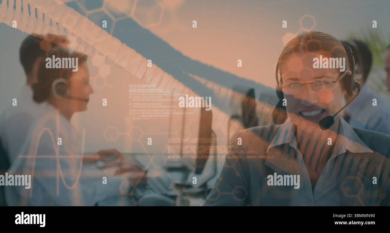 Smiling agent with headset handling calls at open-plan office, with ...