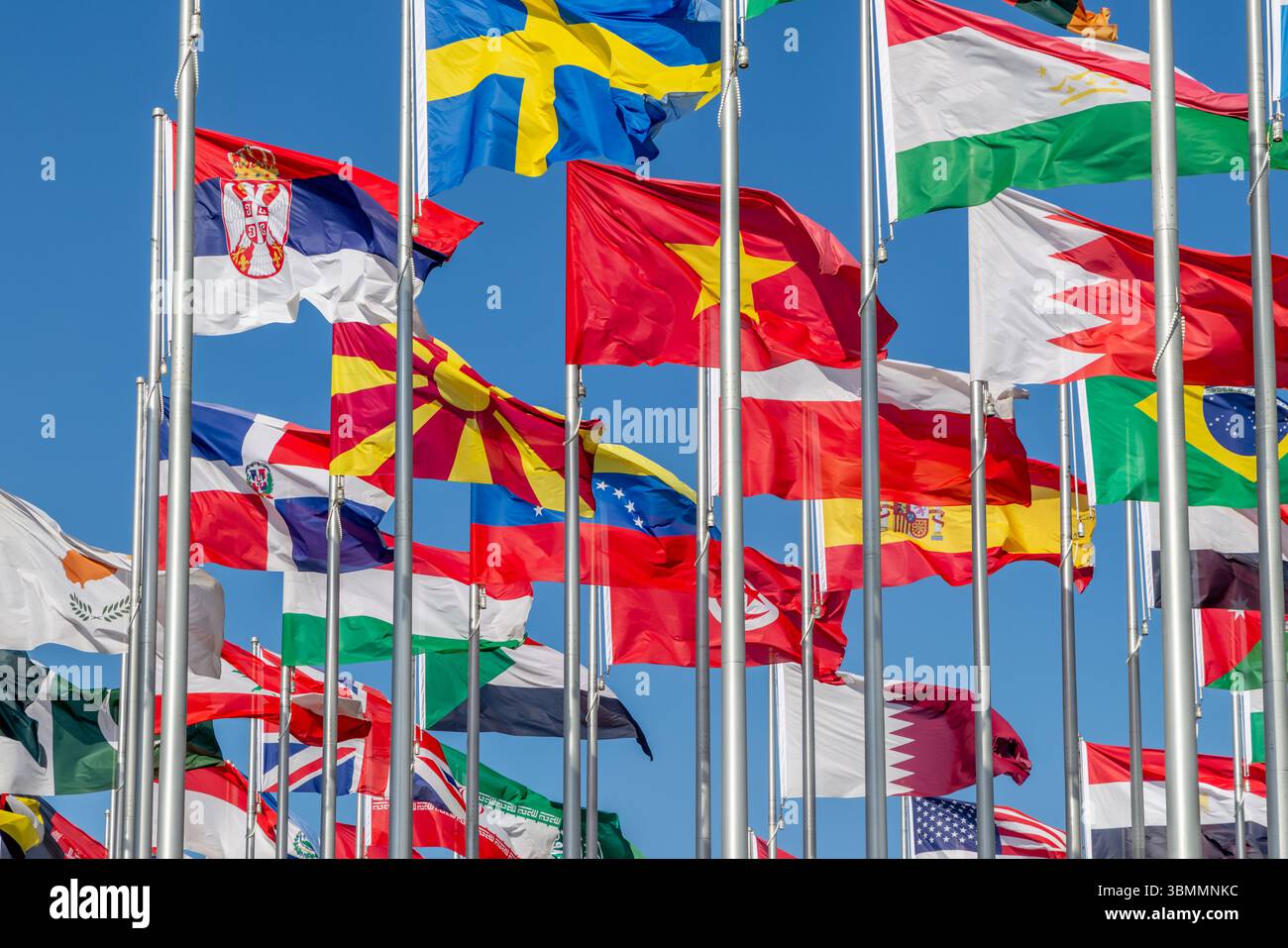Lots of world's countries national flags waving on the wind, with ...