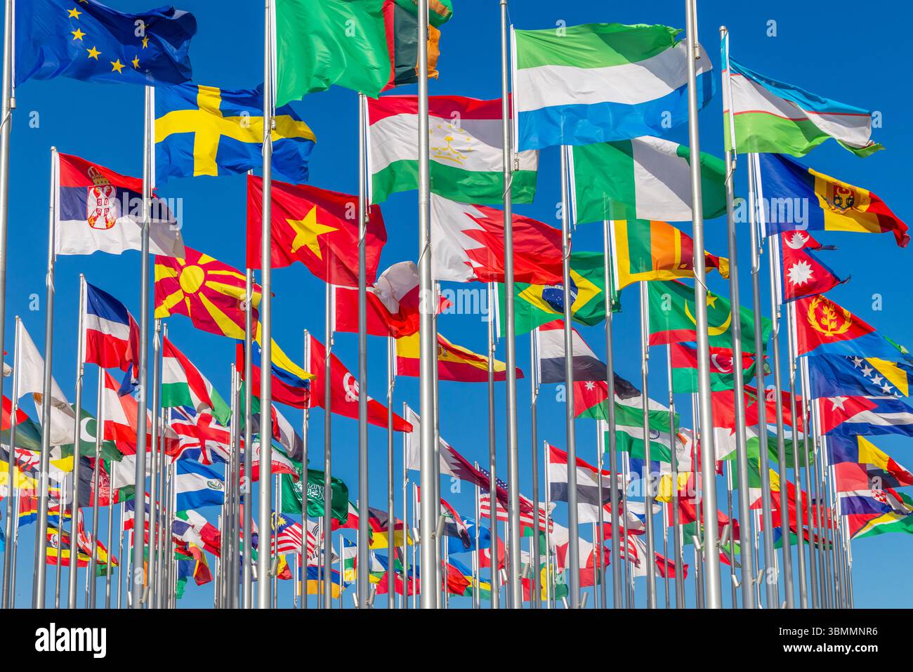 Lots of world's countries national flags waving on the wind, with ...