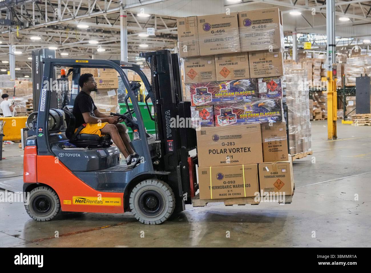 Forklifts carry fireworks ready for shipping at the Phantom Fireworks ...