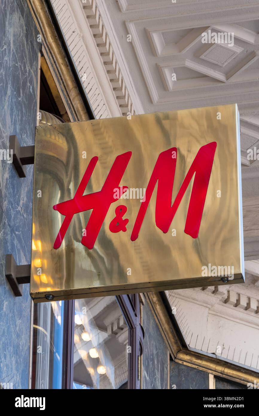 The facade of the H&M store with a recognizable red logo. Austria ...