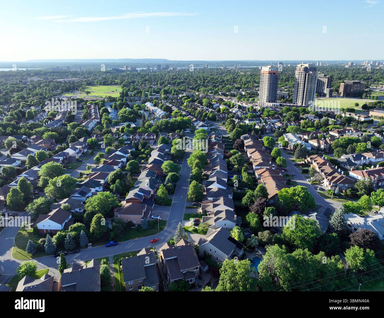 A sprawling urban and suburban landscape features residential areas ...
