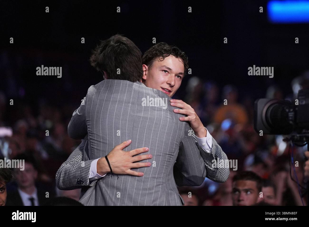 Matthew Schaefer, right, is congratulated after being drafted by the ...