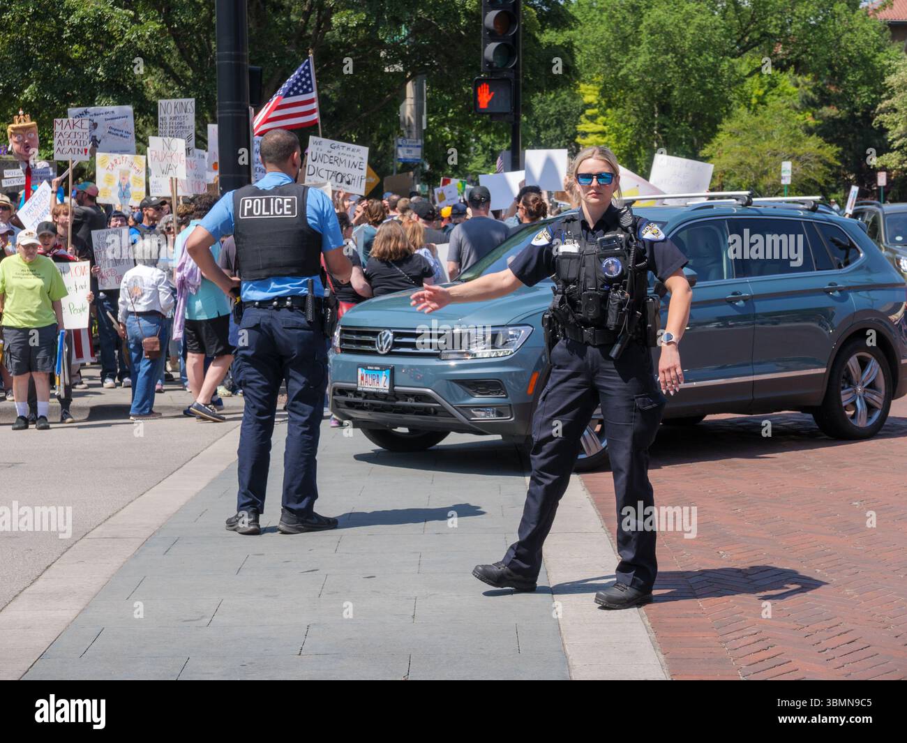 Police officers direct traffic during No Kings march, Oak Park ...
