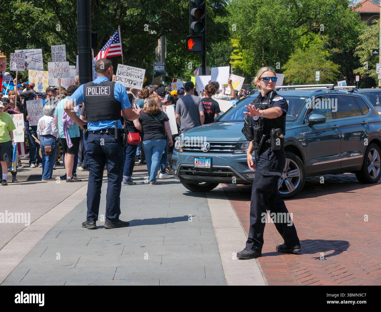 Police officers direct traffic during No Kings march, Oak Park ...
