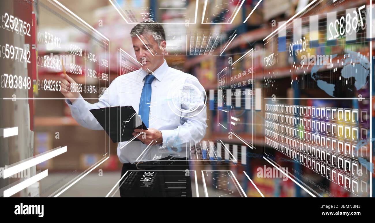 Warehouse manager in suit holding tablet inspecting shelves in ...
