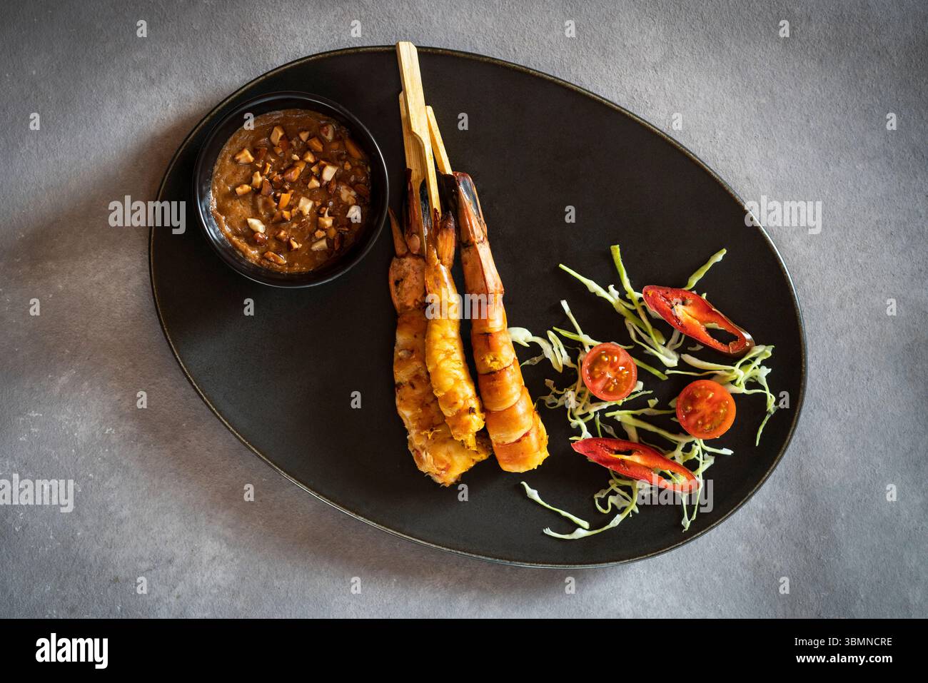 Prawn skewers with peanut sauce Stock Photo - Alamy