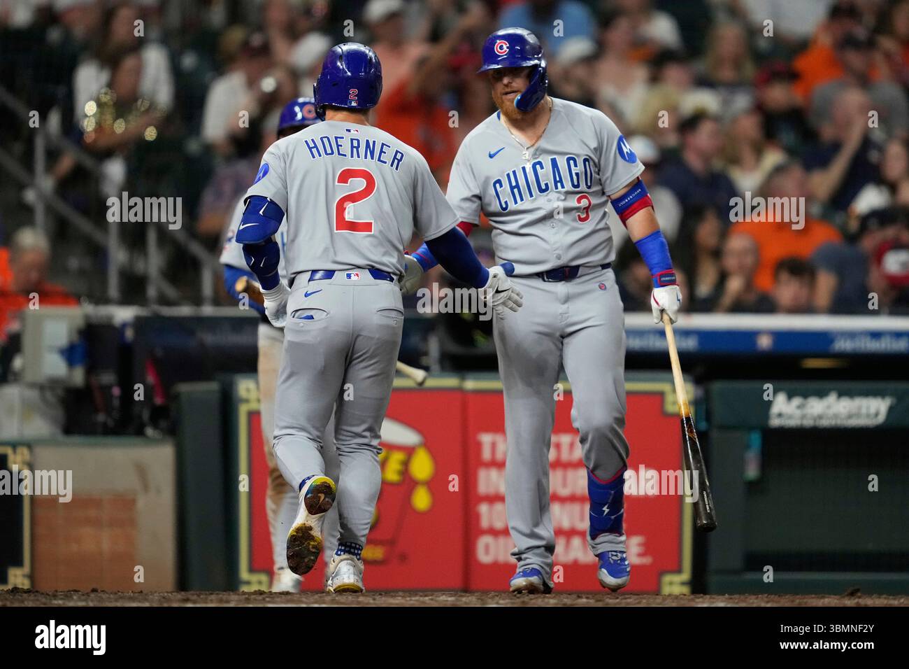 Chicago Cubs' Nico Hoerner (2) celebrates with Justin Turner (3) after ...