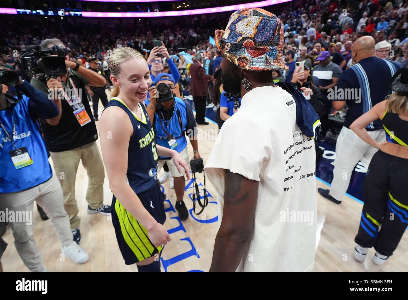 Dallas Wings guard Paige Bueckers, left, greets Dallas Mavericks NBA ...