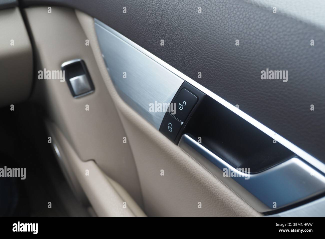 Car door panel with controls in a luxury vehicle interior Stock Photo ...