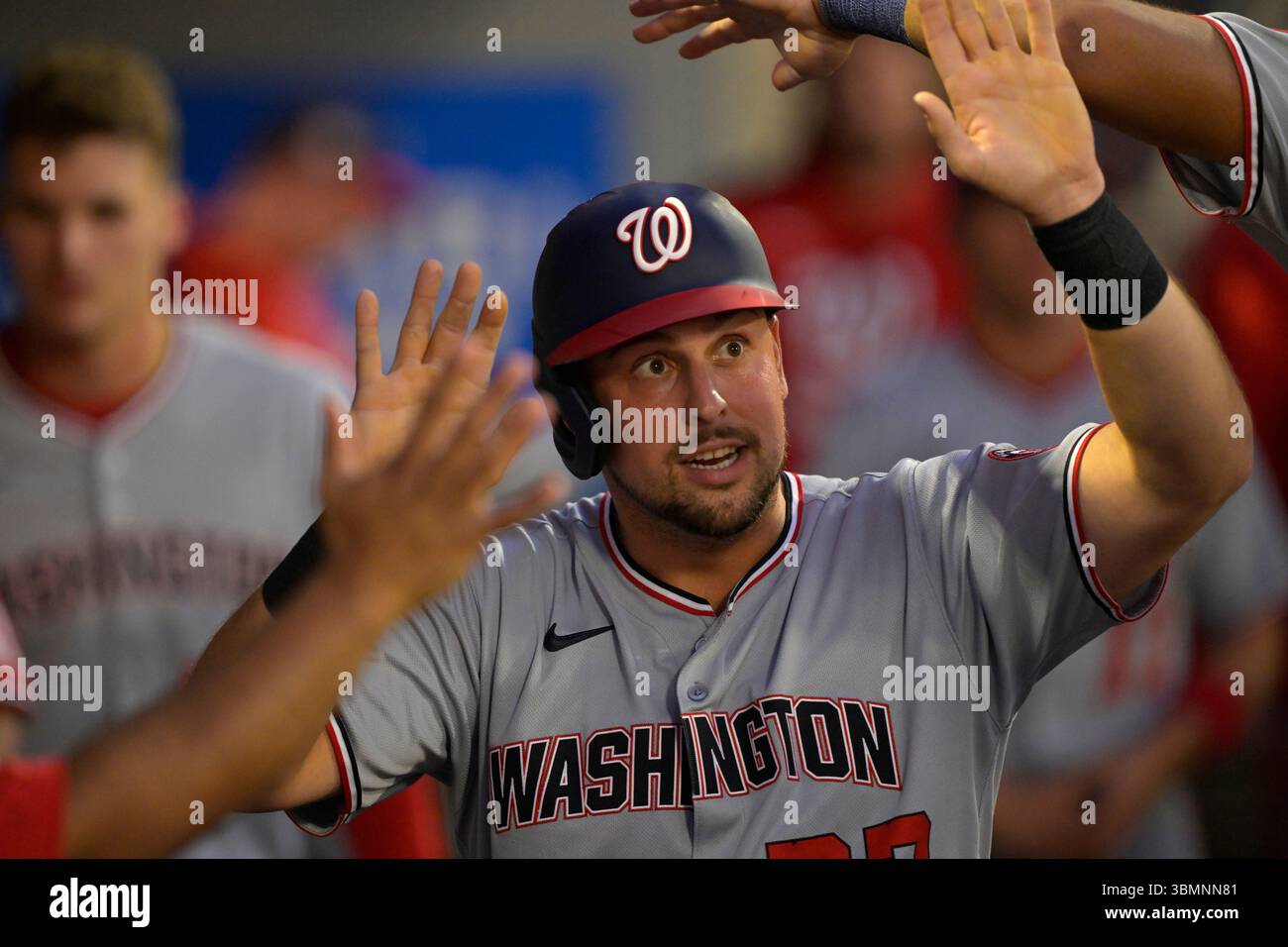 Washington Nationals' Nathaniel Lowe is greeted in the dugout after ...