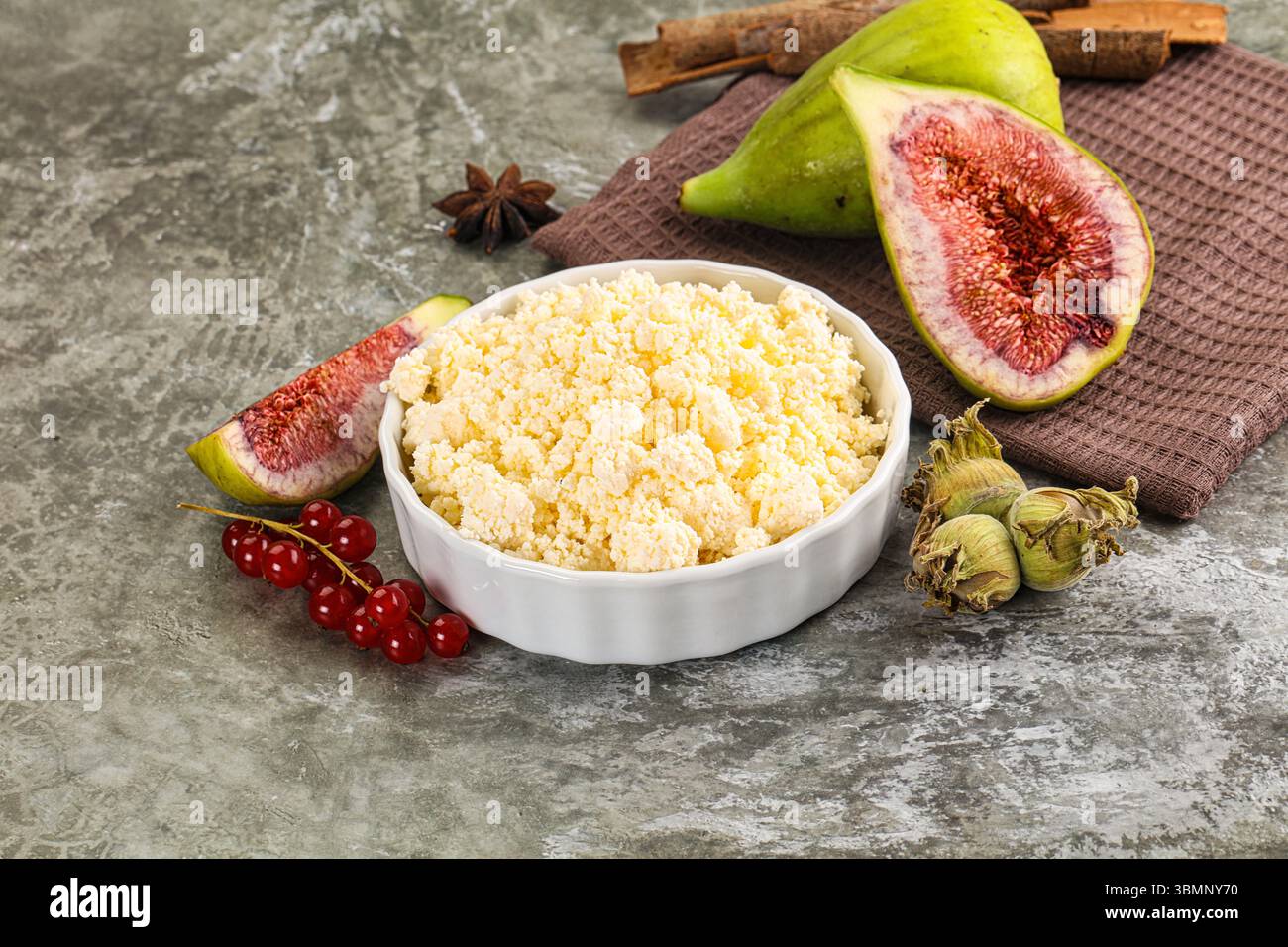 Delicous sheep cottage cheese curd served fig Stock Photo - Alamy