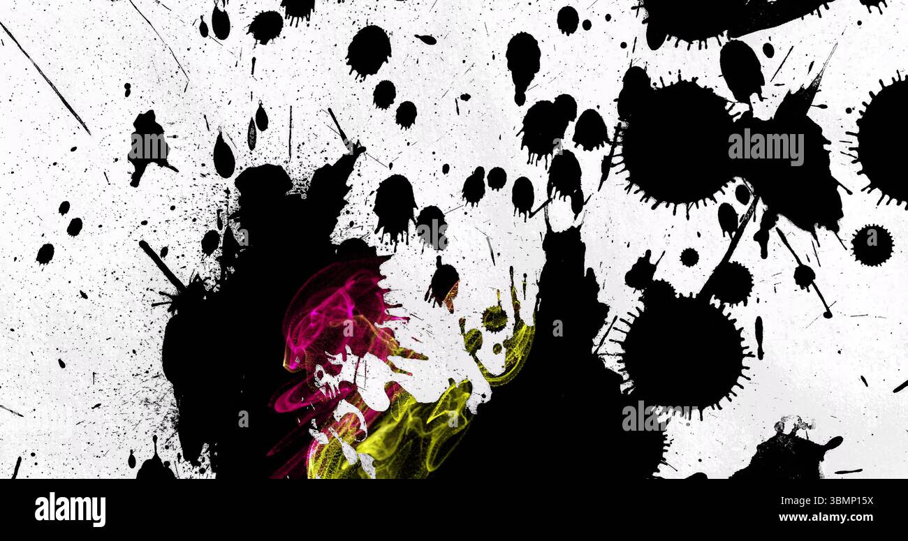 Magenta and yellow smoke swirling and emerging from black ink splatter ...