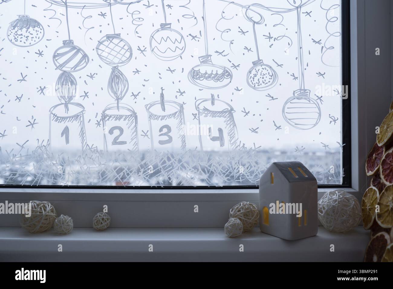 Painted window with white marker. Christmas advent candles decoration ...