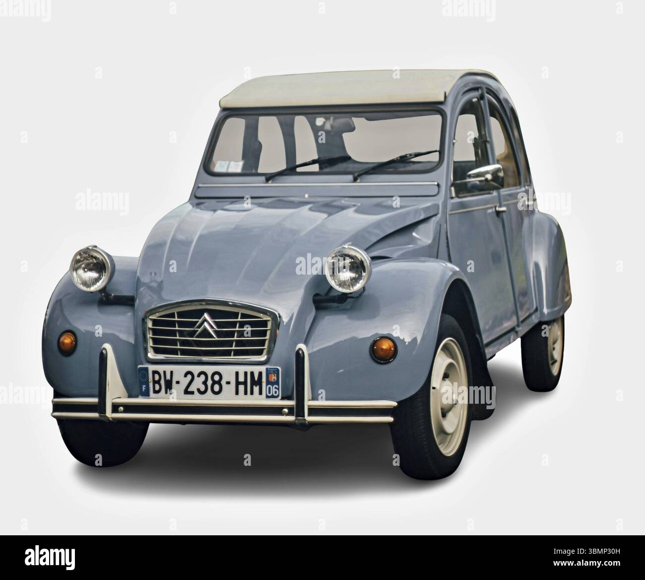 Light blue vintage Citroen 2CV car parked on a white background ...