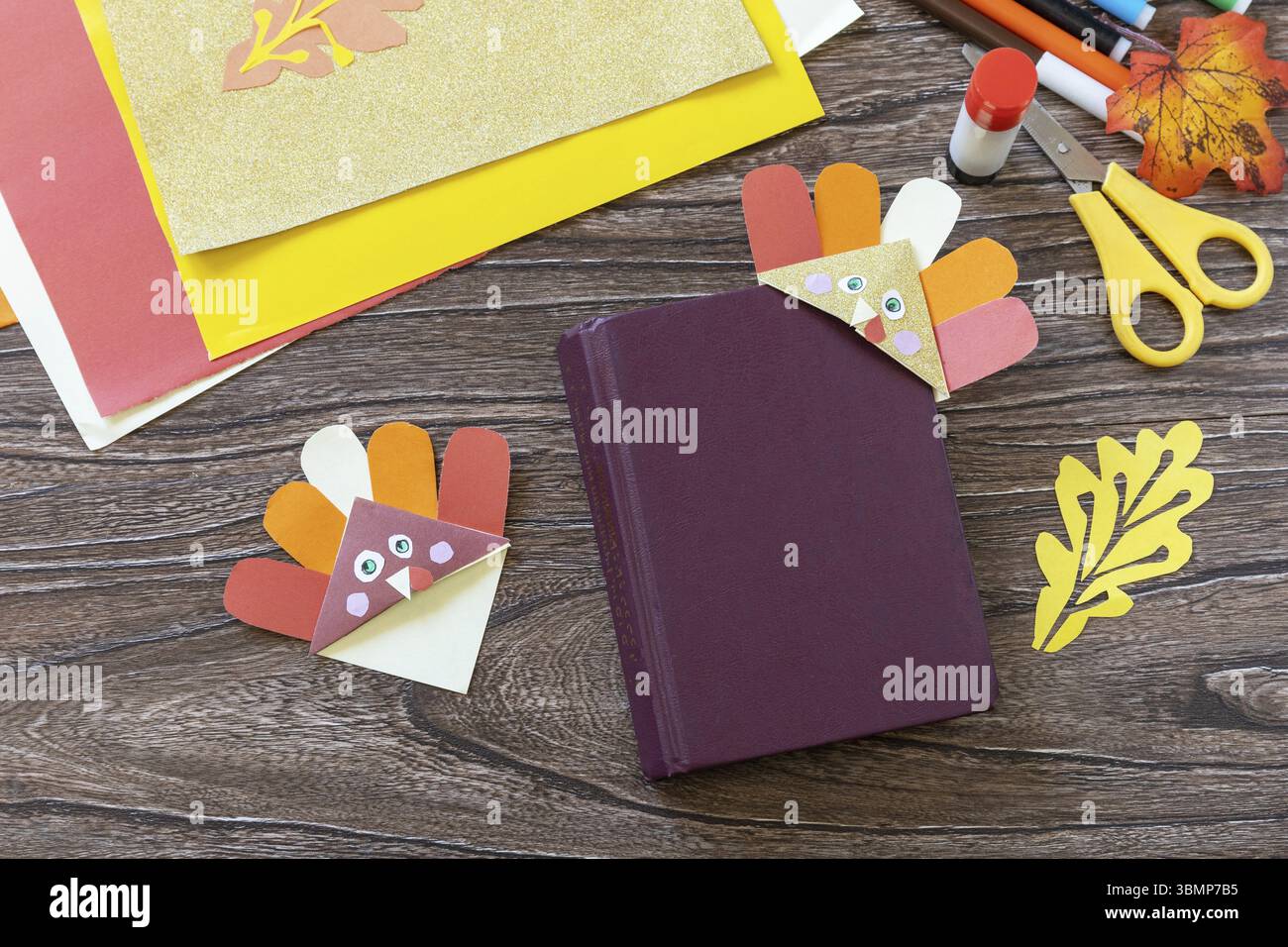 Thanksgiving craft bookmark turkey paper on a wooden table. Childrens ...