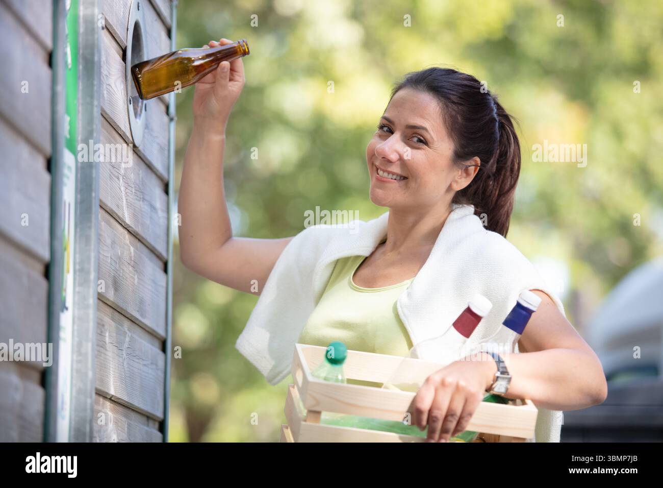 happy aware woman sorting waste Stock Photo - Alamy