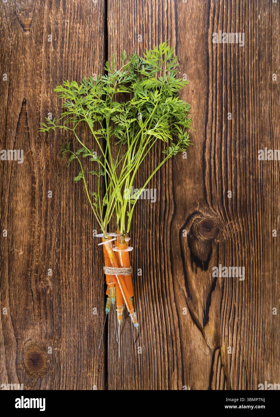 Carrot Juice Injections (on rustic wooden background Stock Photo - Alamy