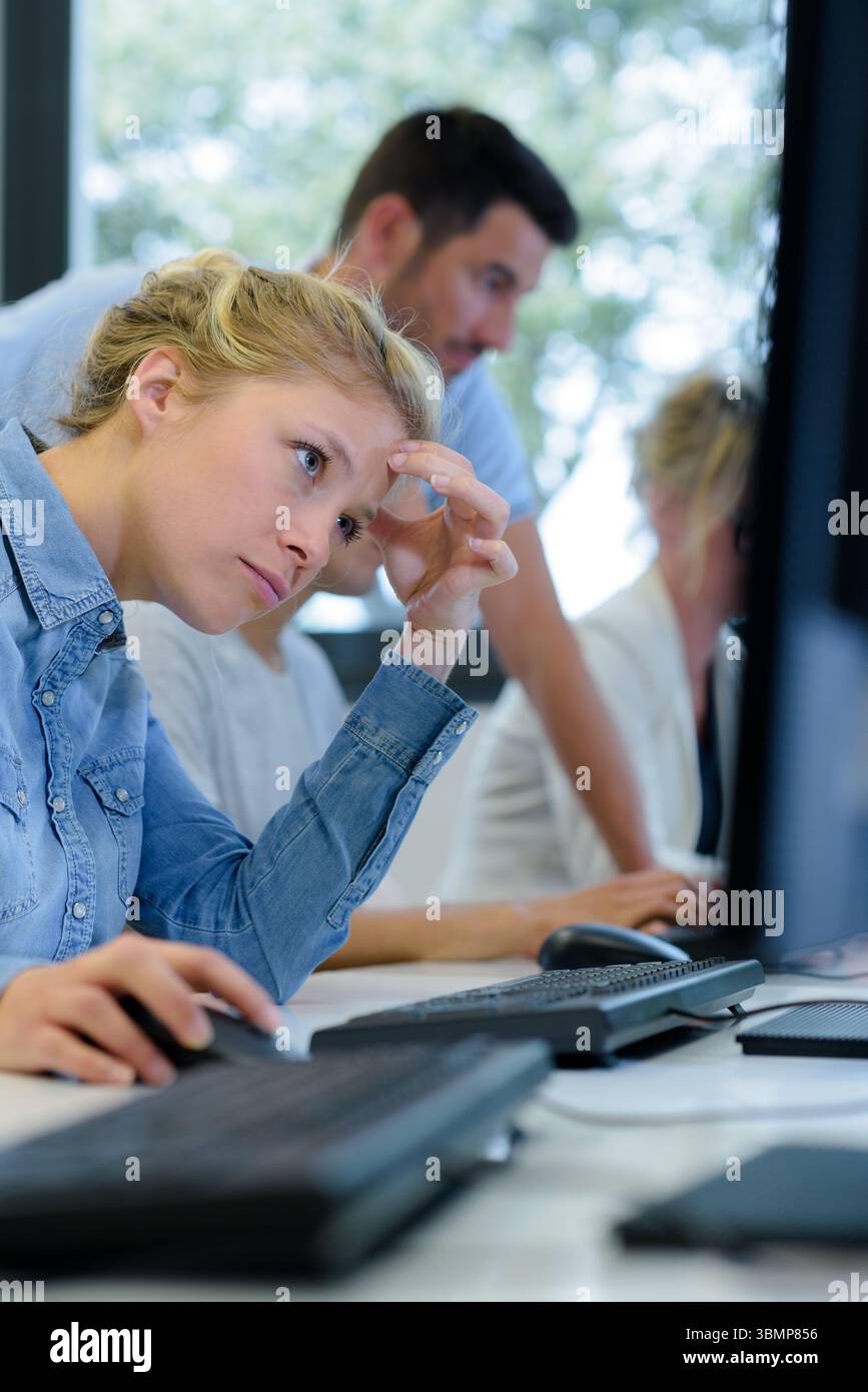 side view of tired students listening a boring lesson Stock Photo - Alamy