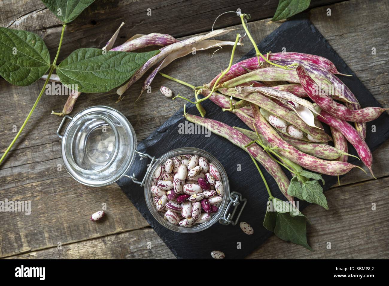 Beans of bean, brown bean (of dried beans) in a glass jar on a rustic ...