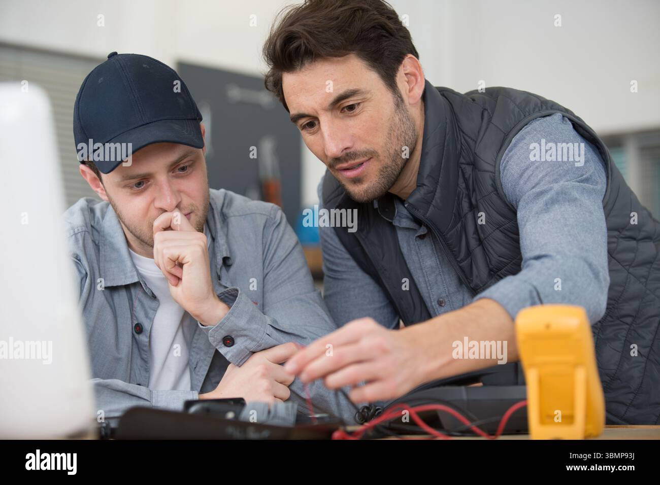manager controlling employee during work Stock Photo - Alamy