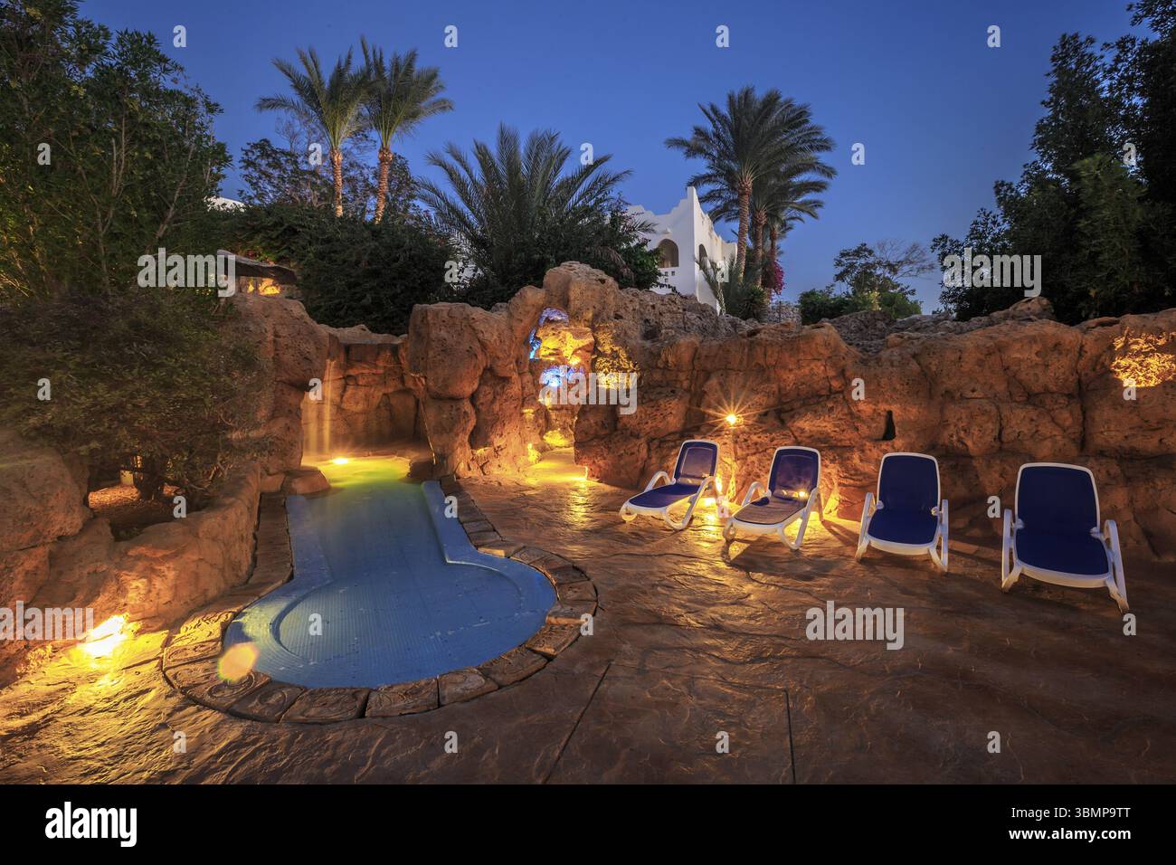 Evening view for luxury swimming pool in night illumination on a ...