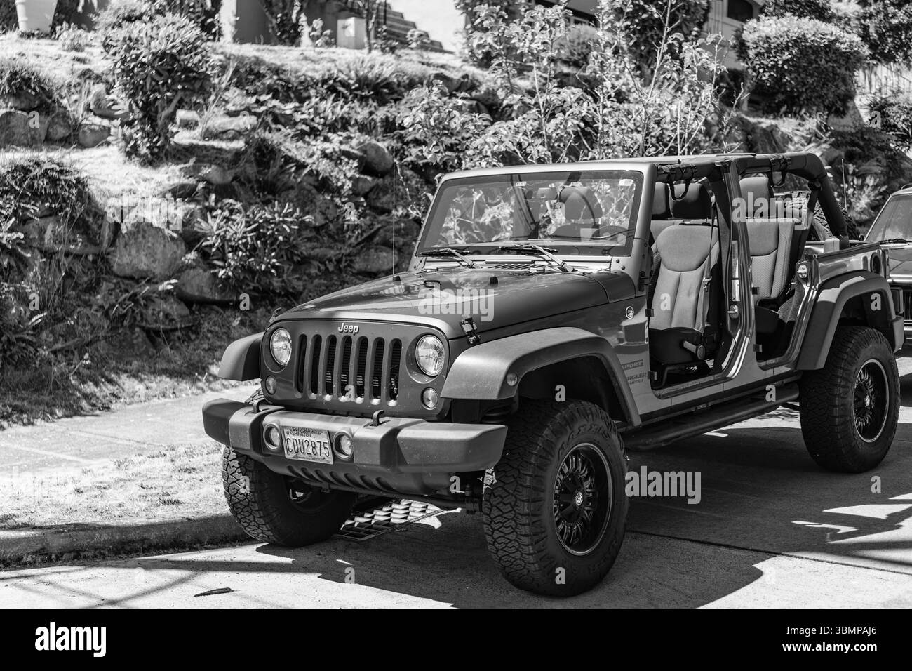 Seattle, WA, USA -July 3, 2024: jeep wrangler jk trail blue side corner ...