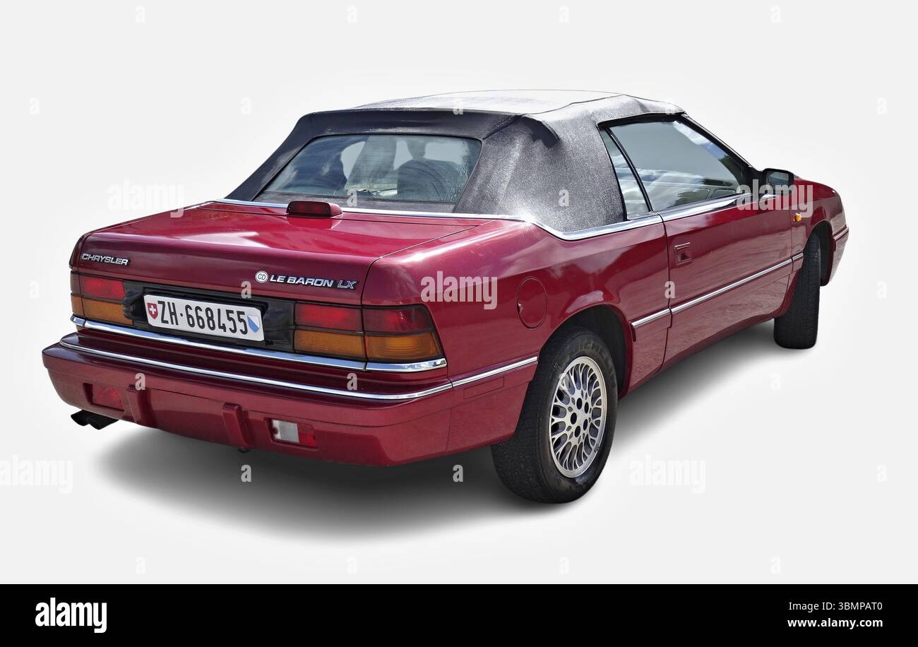 Classic red Chrysler LeBaron convertible parked, showing its closed ...