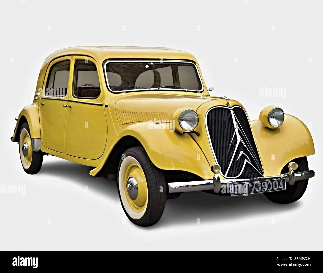 Classic yellow Citroen Traction Avant parked, showcasing its innovative ...