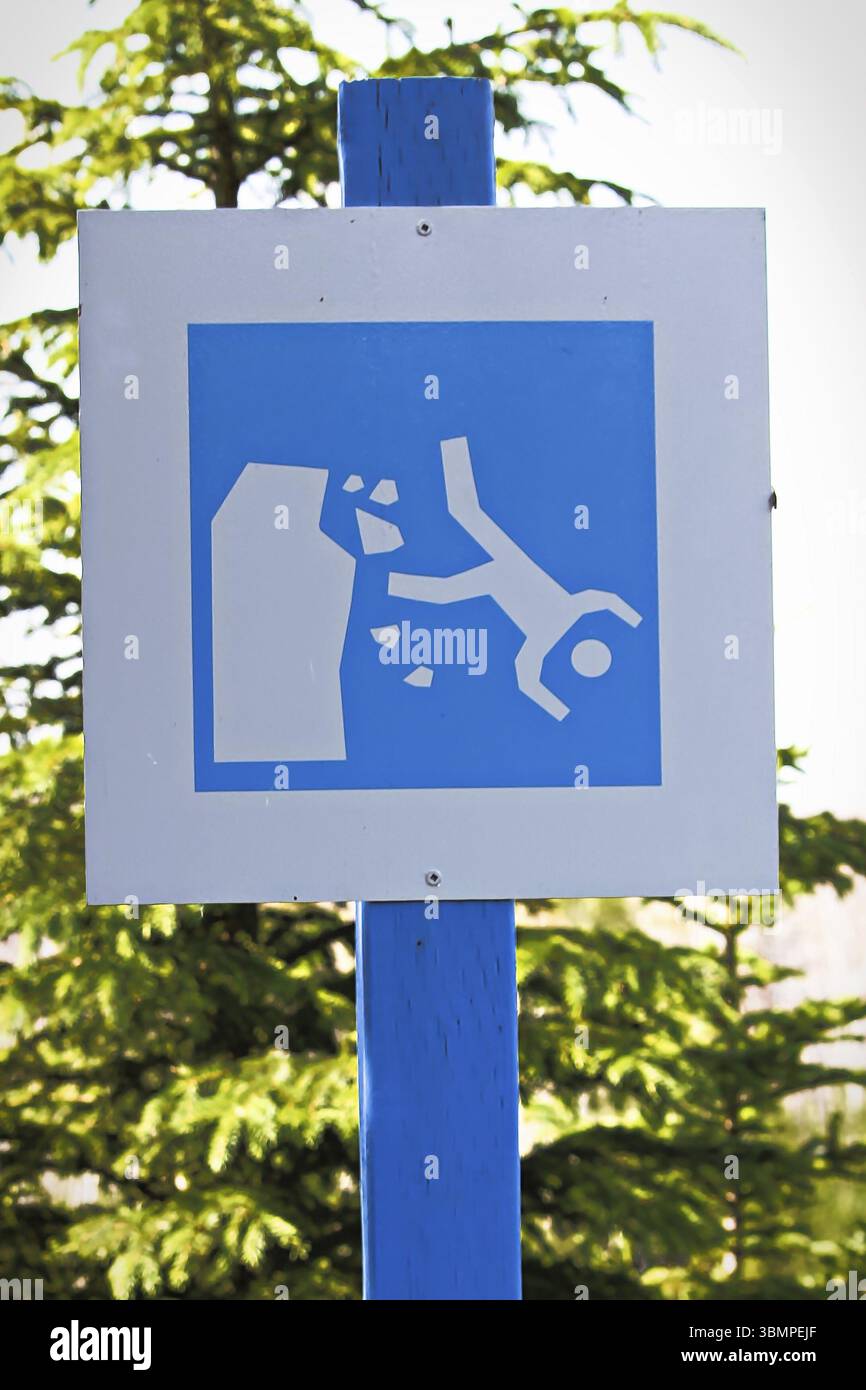 An blue unstable dangerous cliff edge sign Stock Photo - Alamy