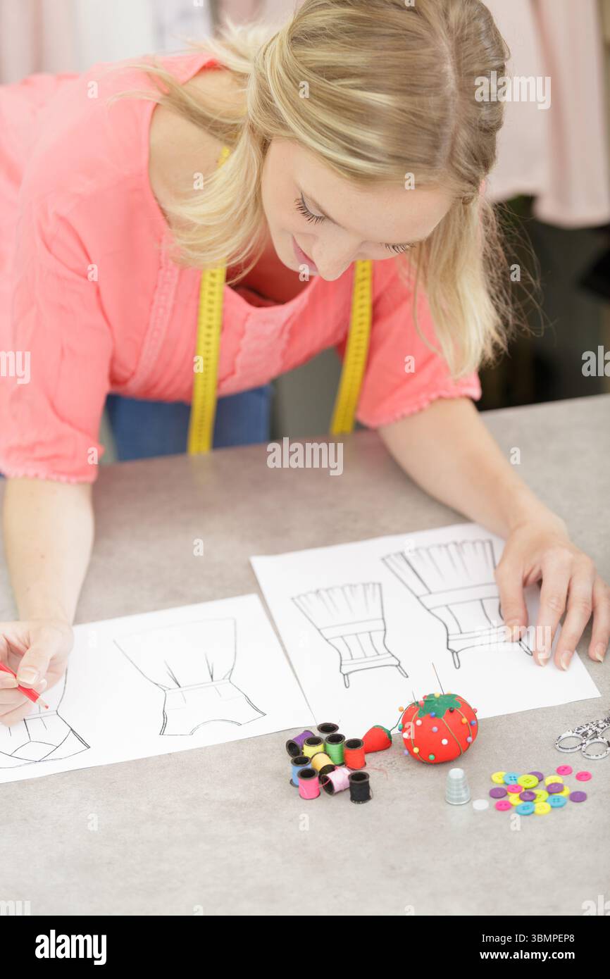 Clothing design entrepreneur checking hi-res stock photography and ...