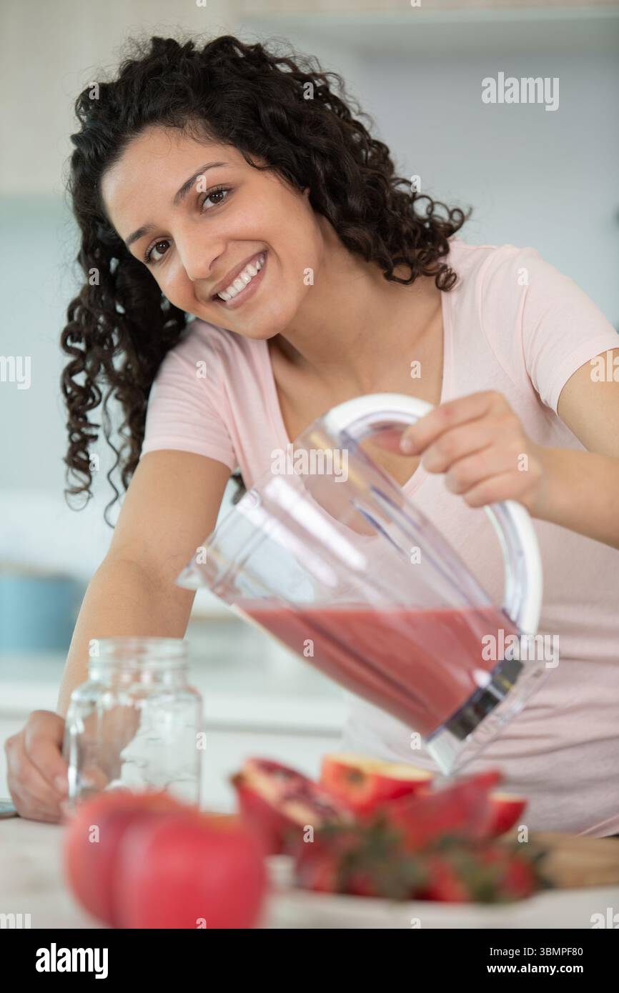 Woman pouring tasty juice from hi-res stock photography and images - Alamy