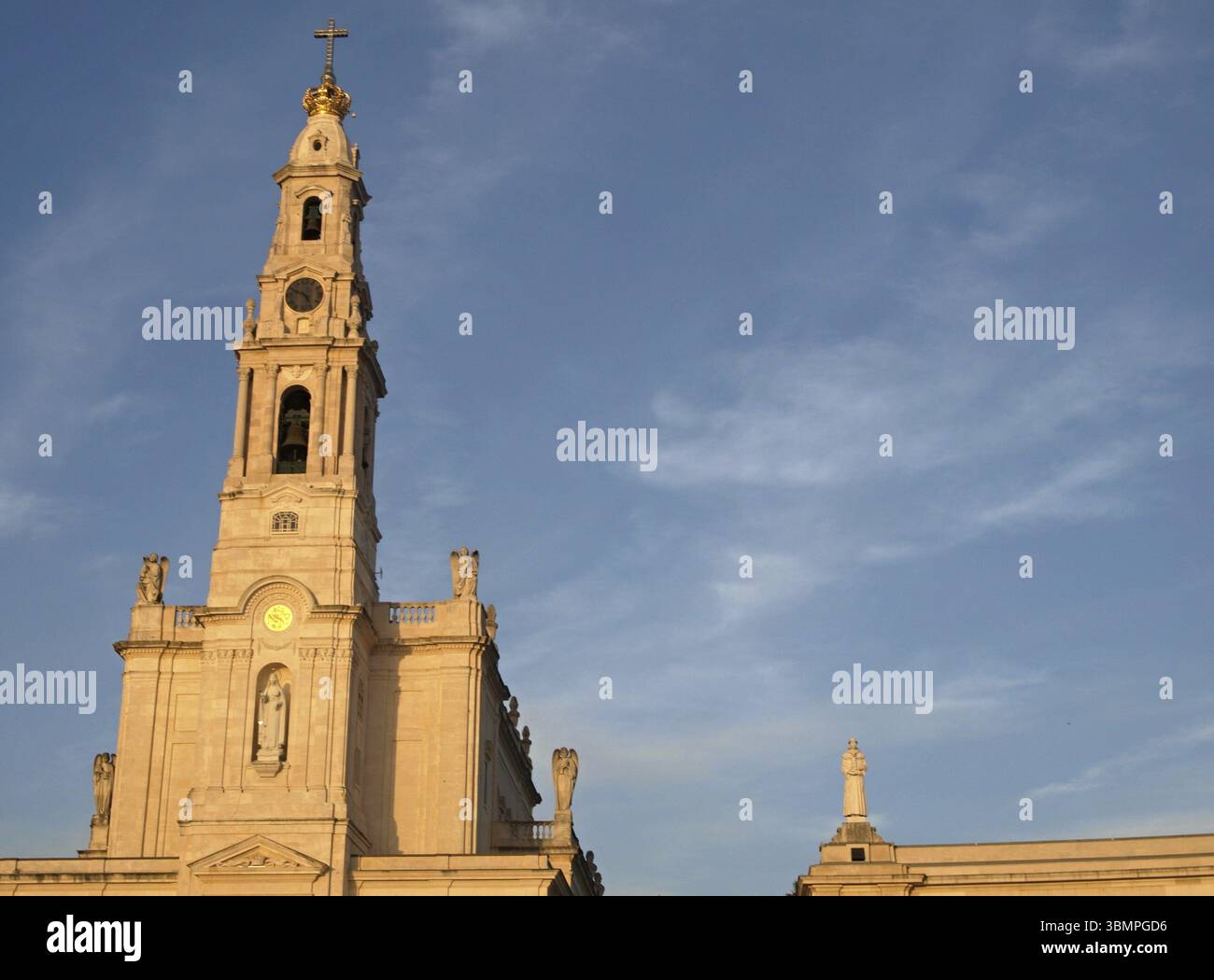 Sanctuary of Fatima basilica with its iconic tower and statue, a ...