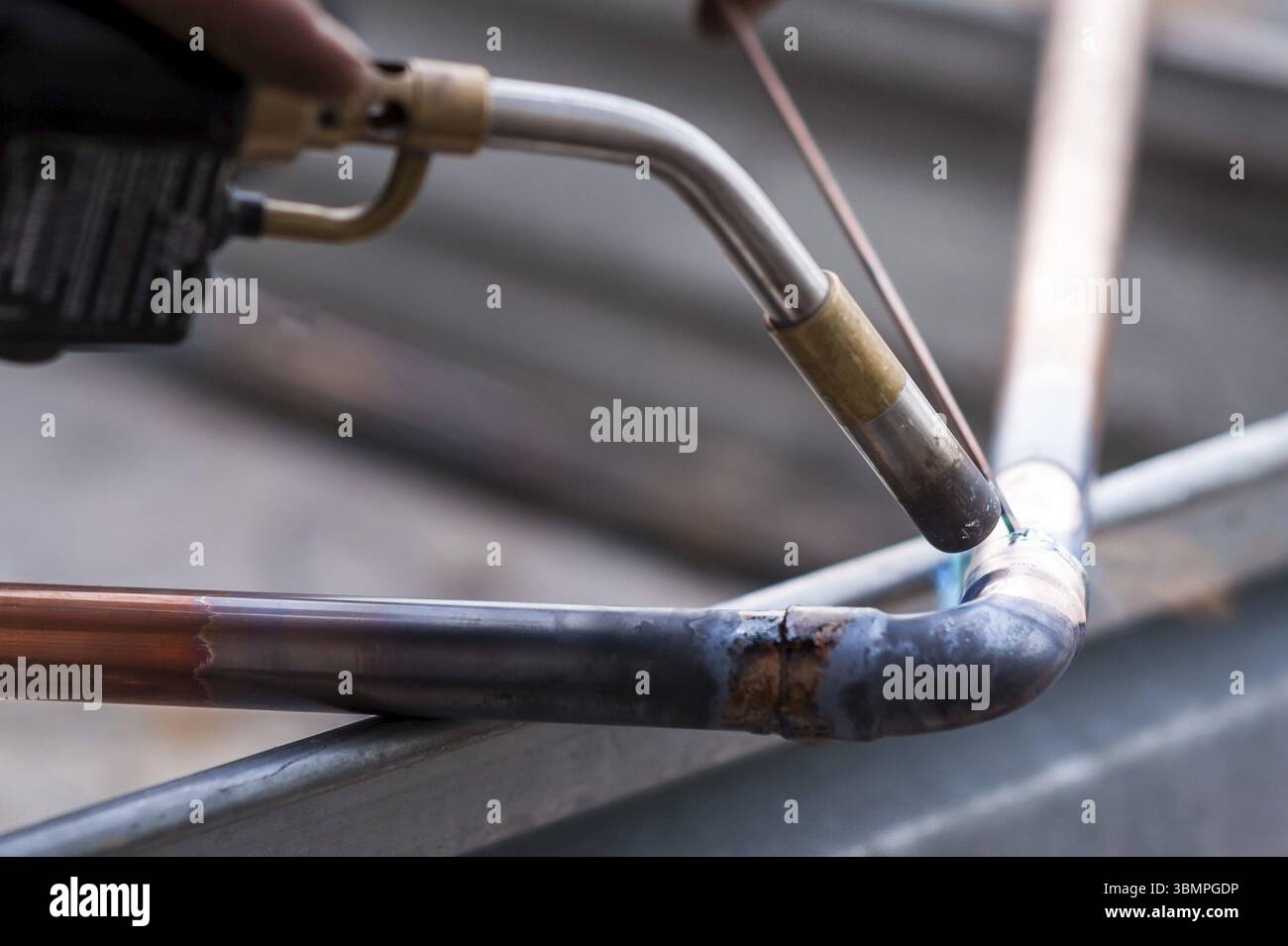 Welding of copper pipe of a methane gas pipeline or of a conditioning ...