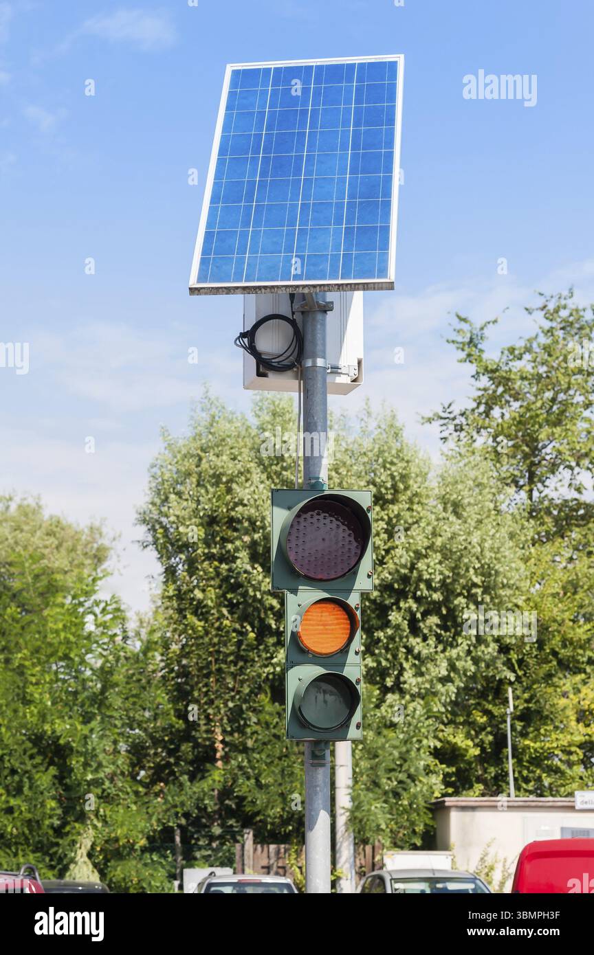 Road traffic light powered by electricity generated from a solar panel ...
