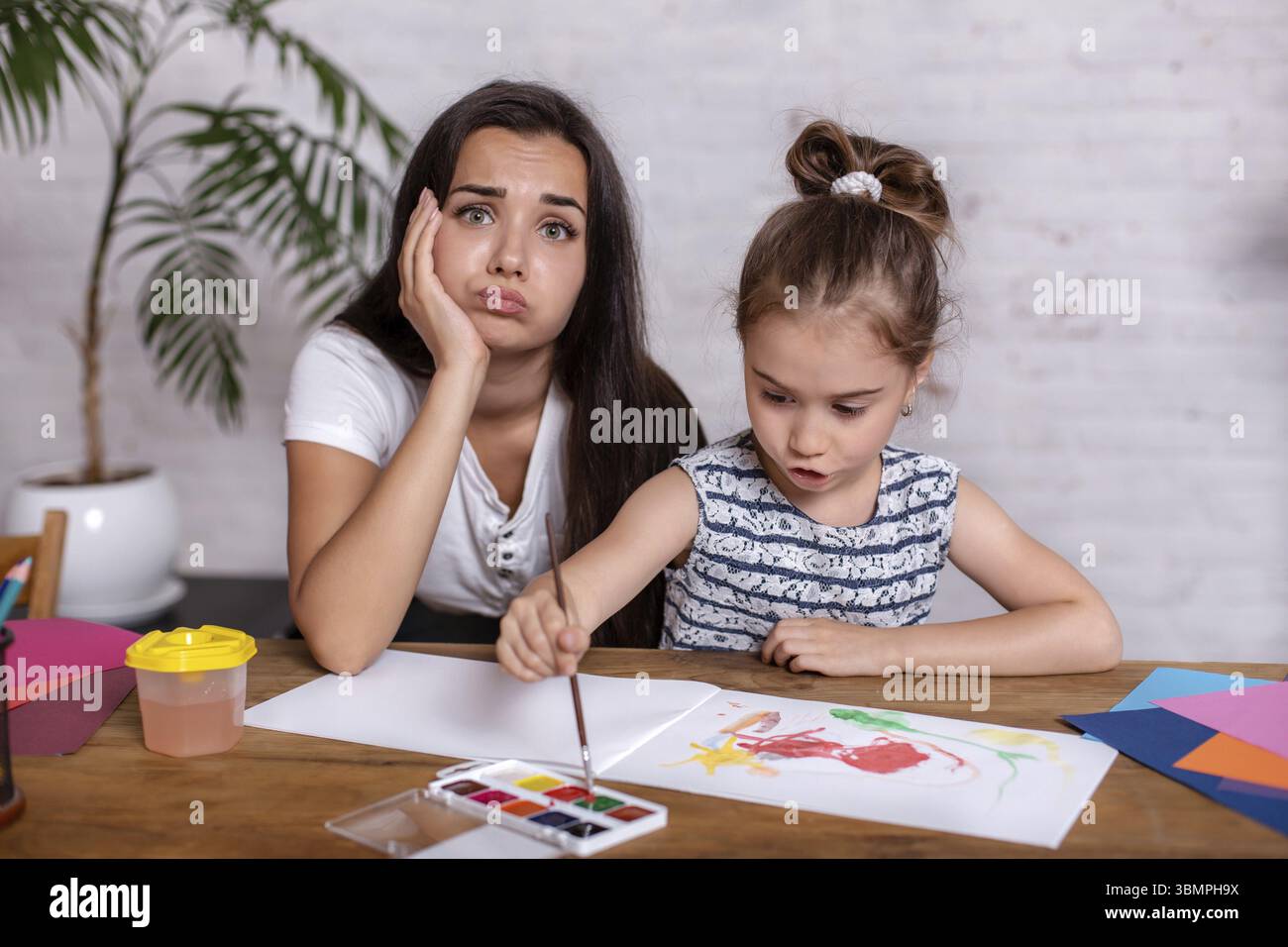 Happy mother helps daughter girl hi-res stock photography and images ...