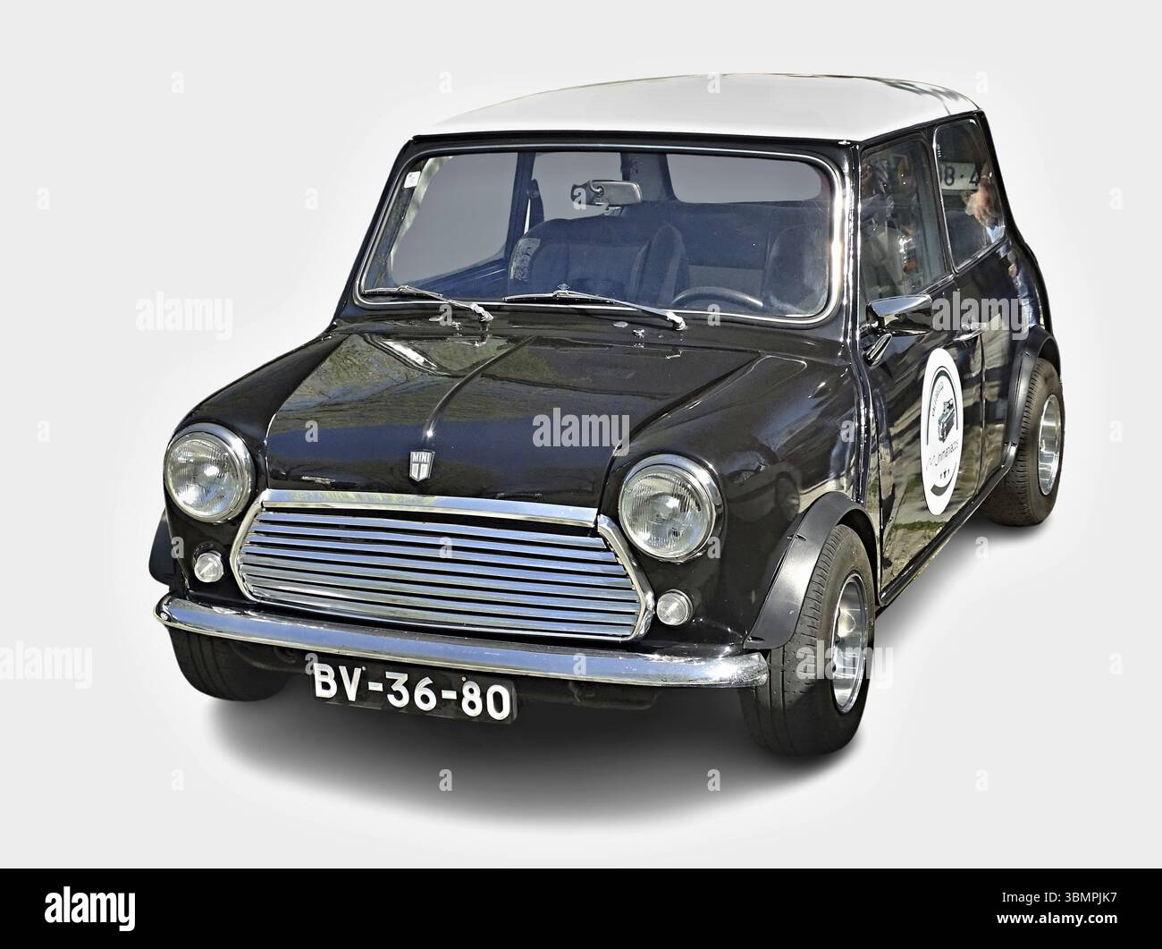 Black and white Mini Cooper parked, showing its timeless design Stock ...