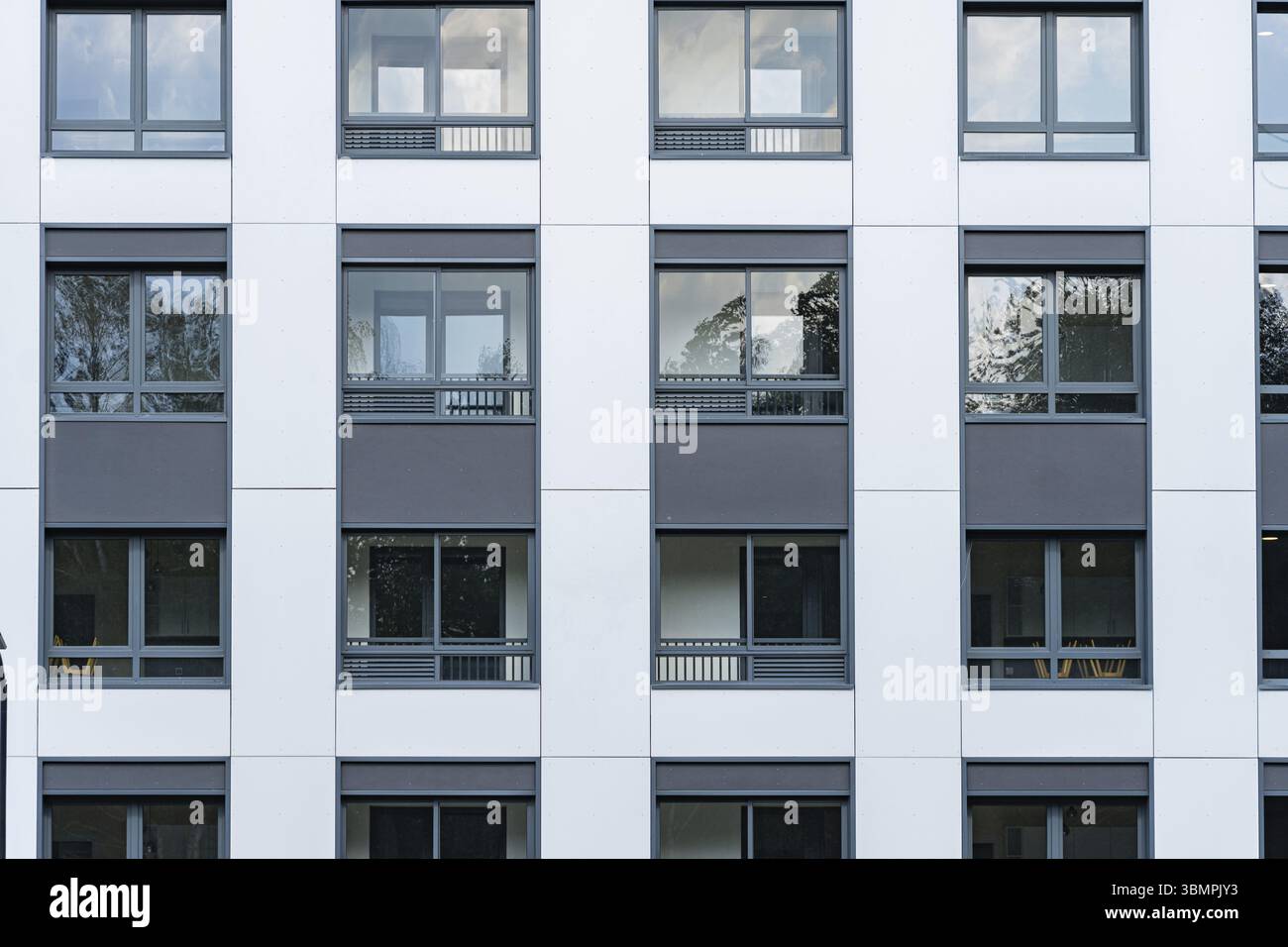 New building facade in housing complex. Modern style in architecture ...