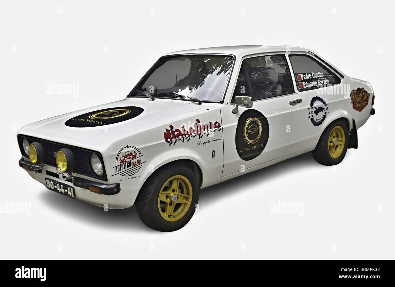 Classic white Ford Escort rally car showcasing various sponsor logos ...