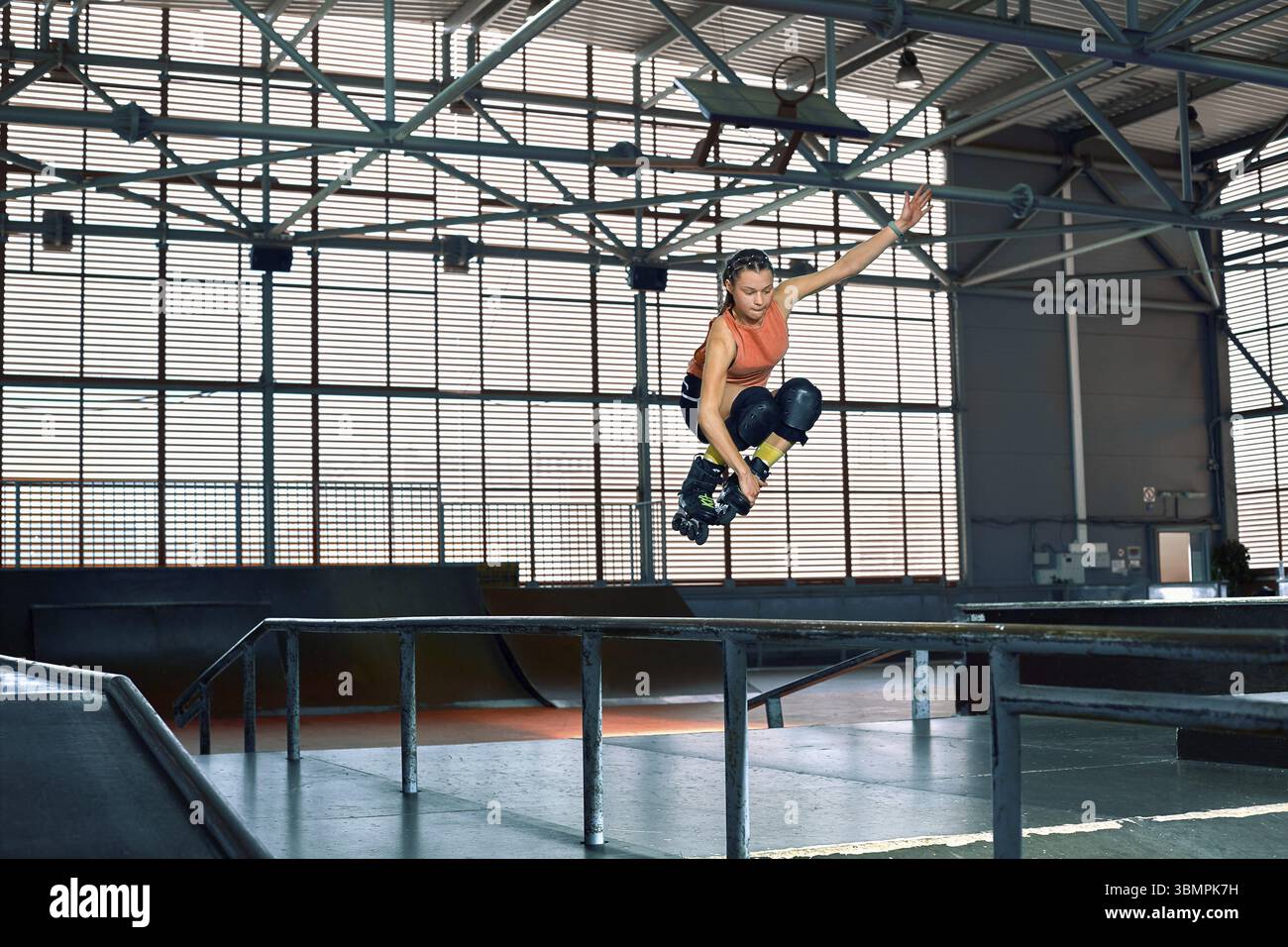 Extreme sport competition show. Rollerblader jump high from big air ...