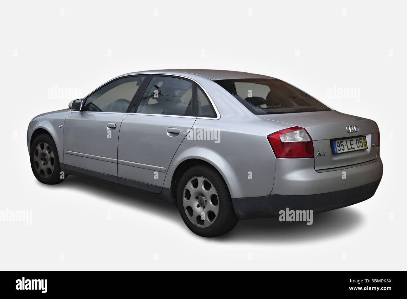 Rear view of a silver Audi A4 B6 sedan isolated on a white background ...