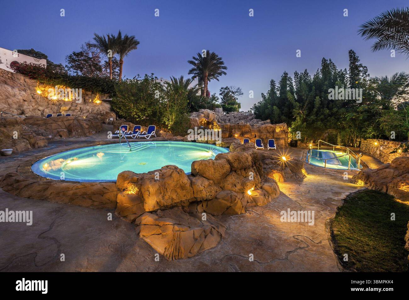 Evening view for luxury swimming pool in night illumination on a ...