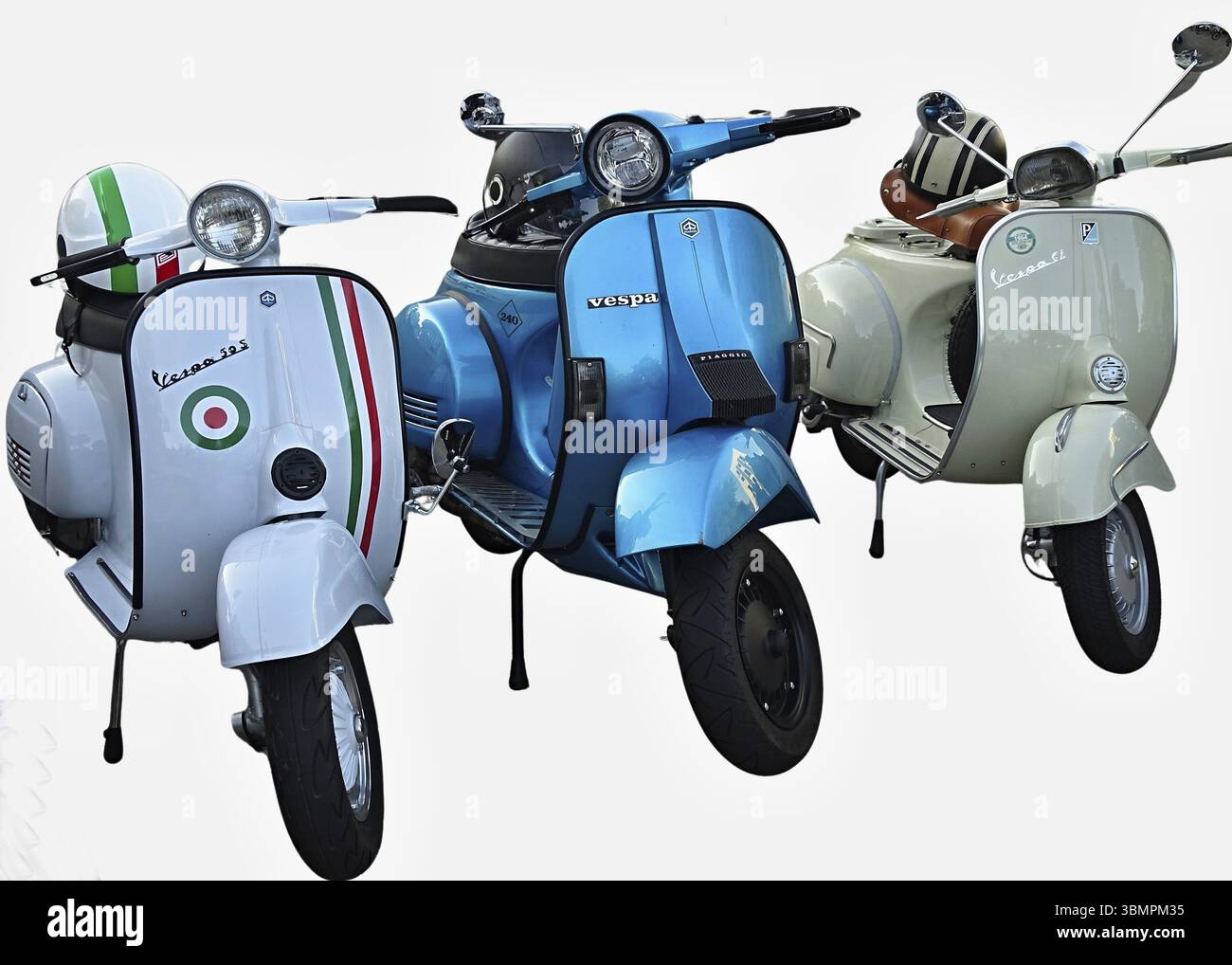 Three Vespa scooters in white, blue and beige, parked next to each ...