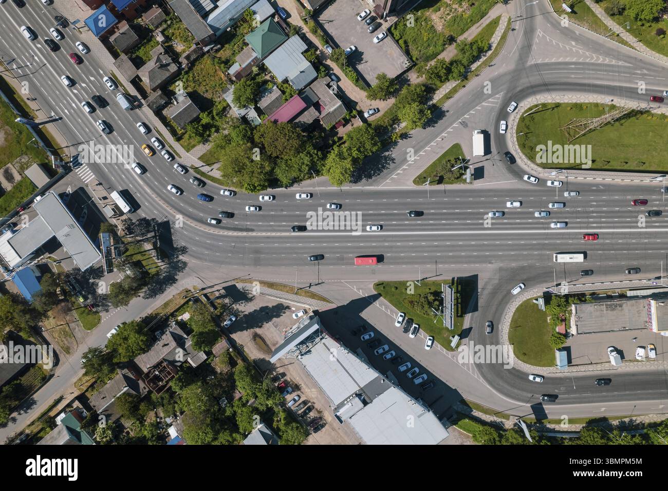 Aerial view of road bridge across river with heavy traffic jam in one ...