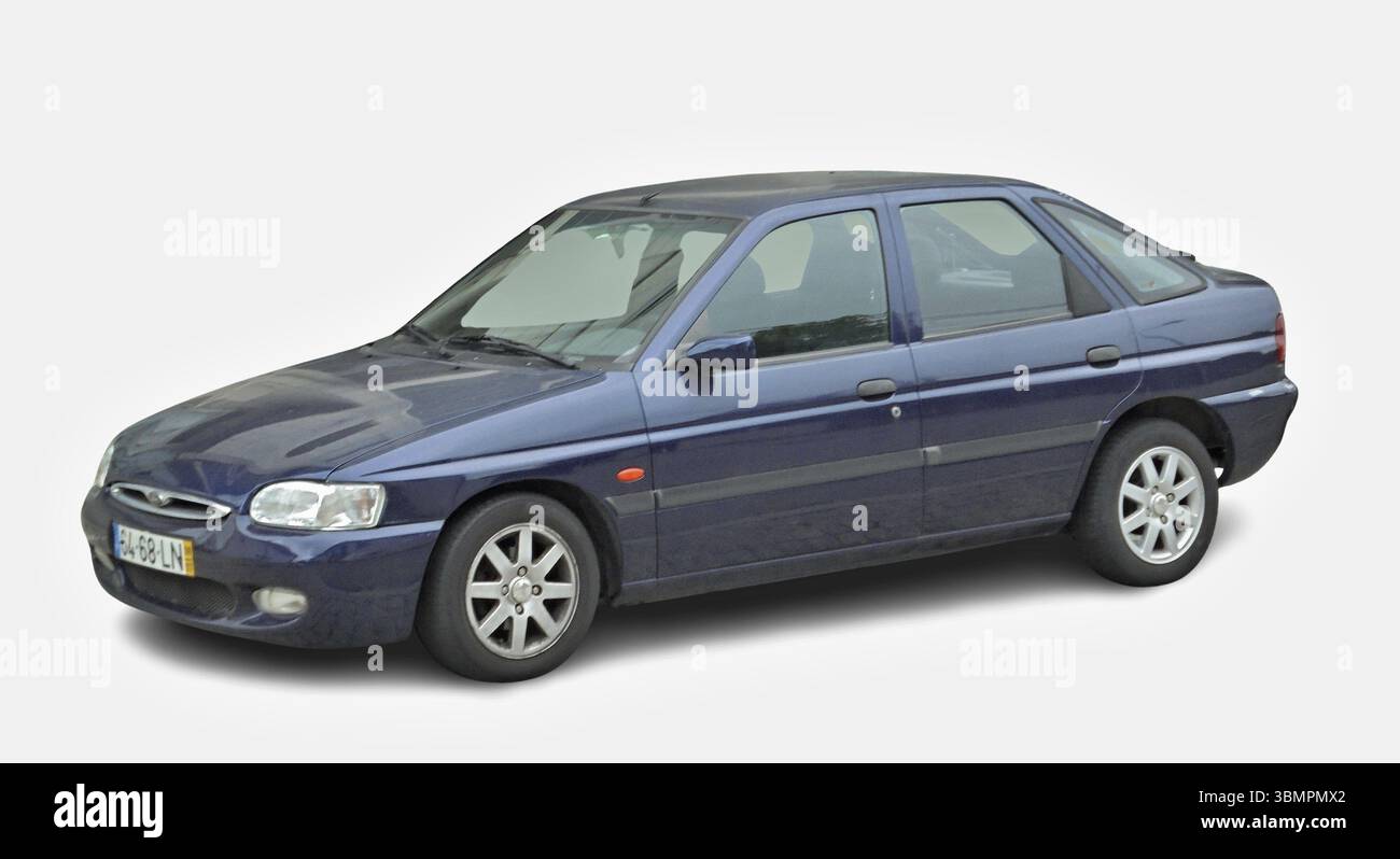 Generic dark blue Ford Escort car parked on a white background ...